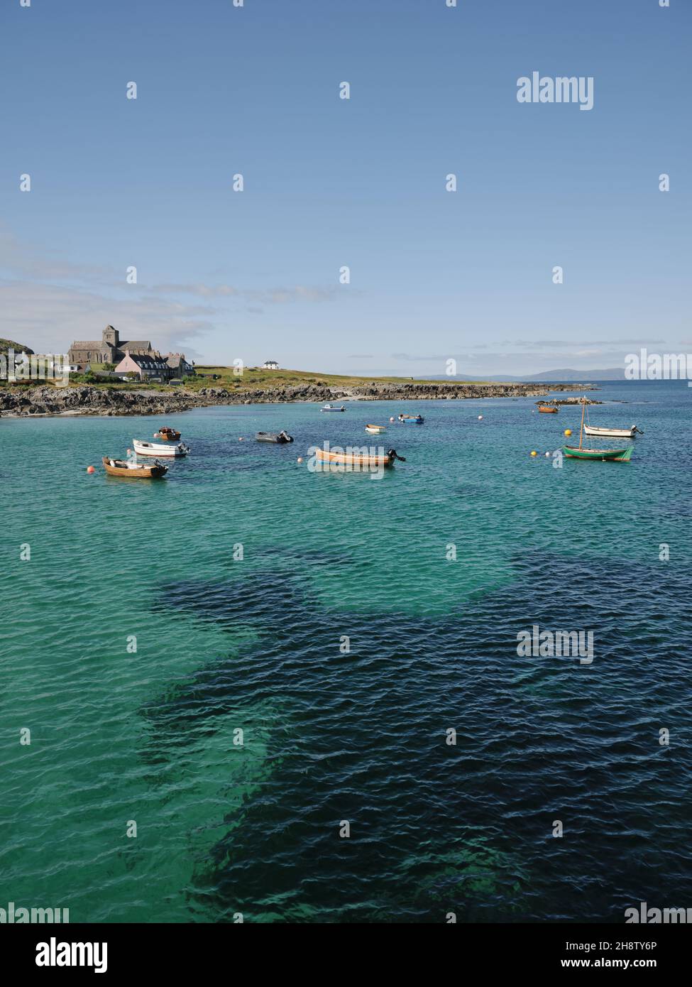 Iona Abbey & boats summer coastline landscape of the Isle of Iona in ...