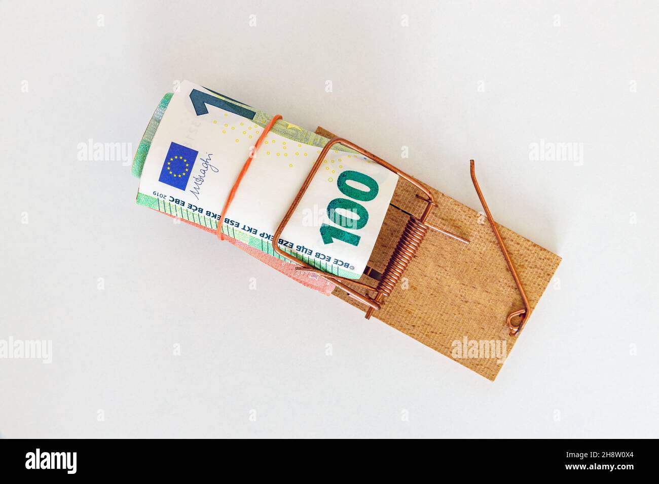 A mouse trap is catching euros and money Stock Photo - Alamy
