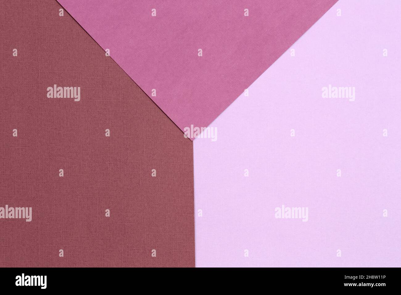 Geometric paper background from purple and pink. Copy space, place for ...