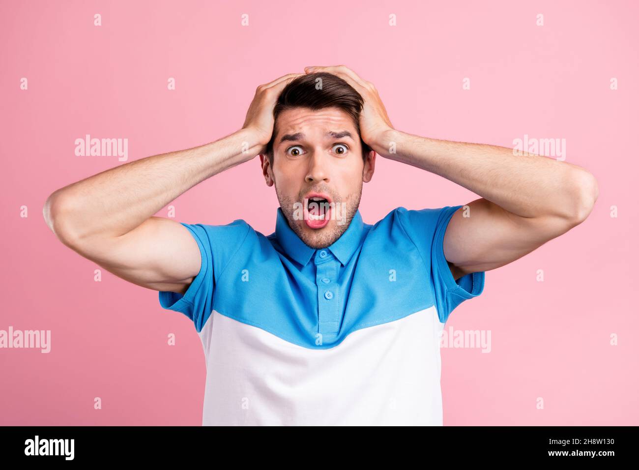 Photo of young shocked frightened amazed guy touch head have big ...