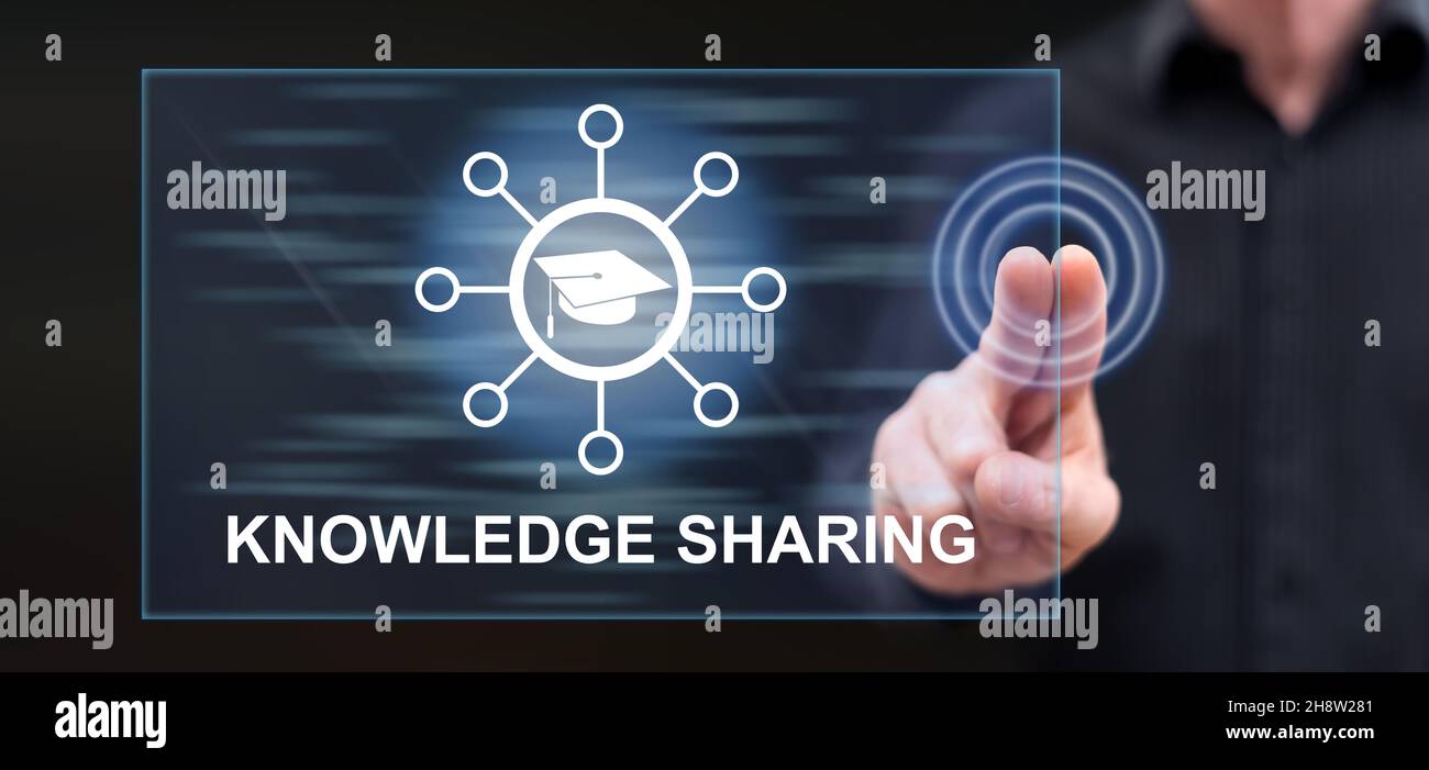 Man touching a knowledge sharing concept on a touch screen with his ...
