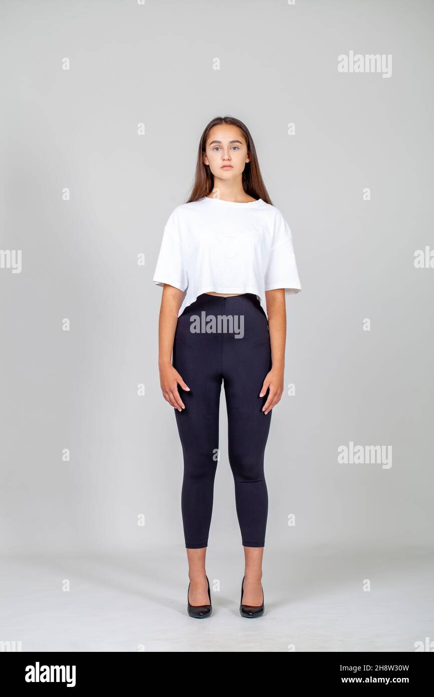 Full body portrait of a young beautiful brunette model, isolated on ...