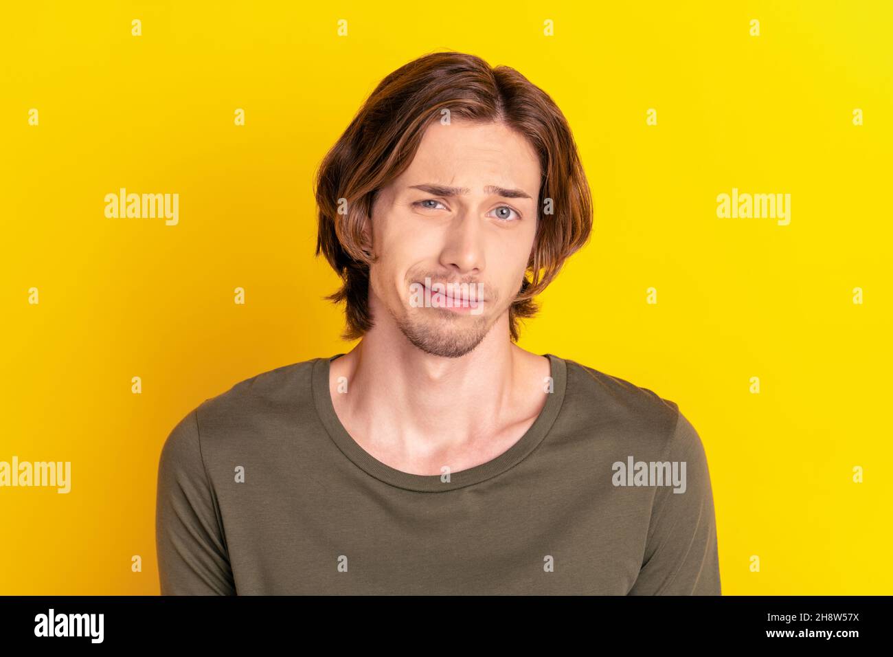 Photo of young handsome man unhappy sad negative shrug shoulders ...