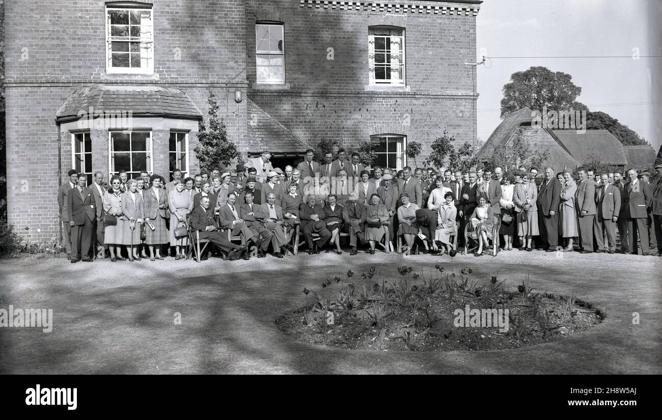 1950s, historical, gathering outside for a group photo, a large number ...
