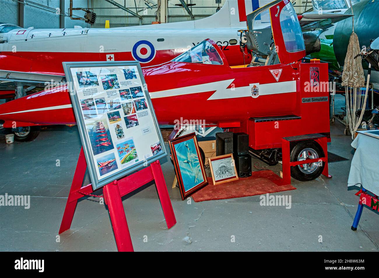 A gnat simulator bearing the insignia of the Red Arrows situated among ...