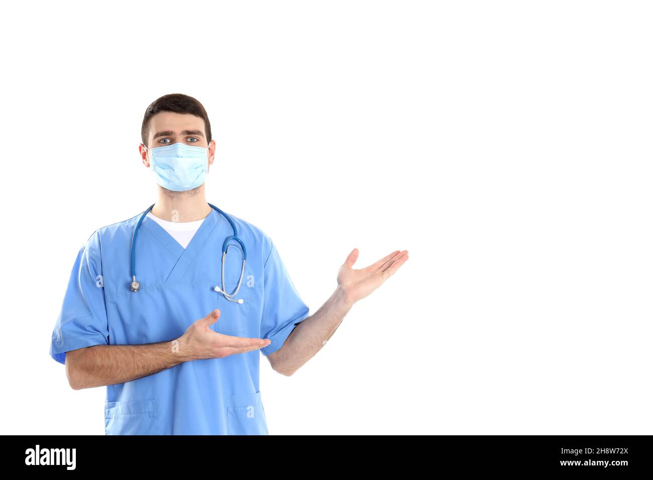 Attractive doctor intern isolated on white background Stock Photo - Alamy