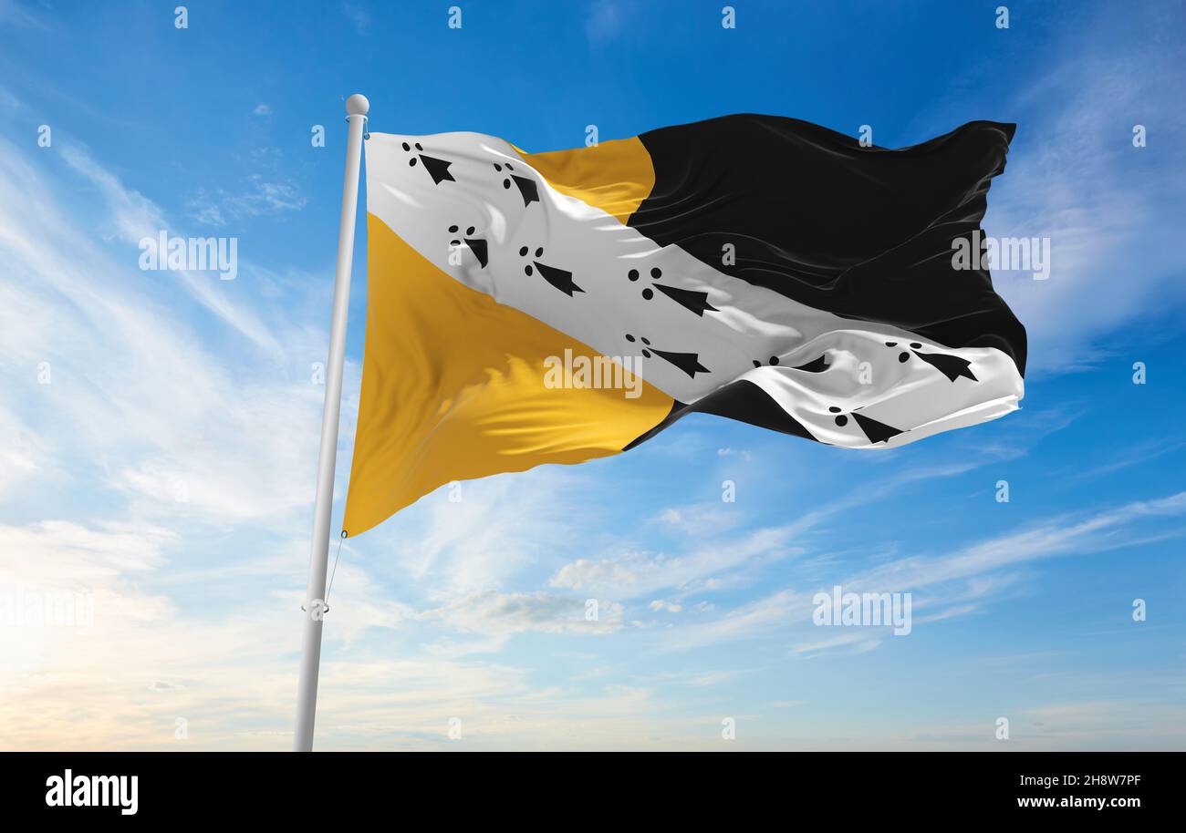 flag of county Norfolk, UK at cloudy sky background on sunset ...