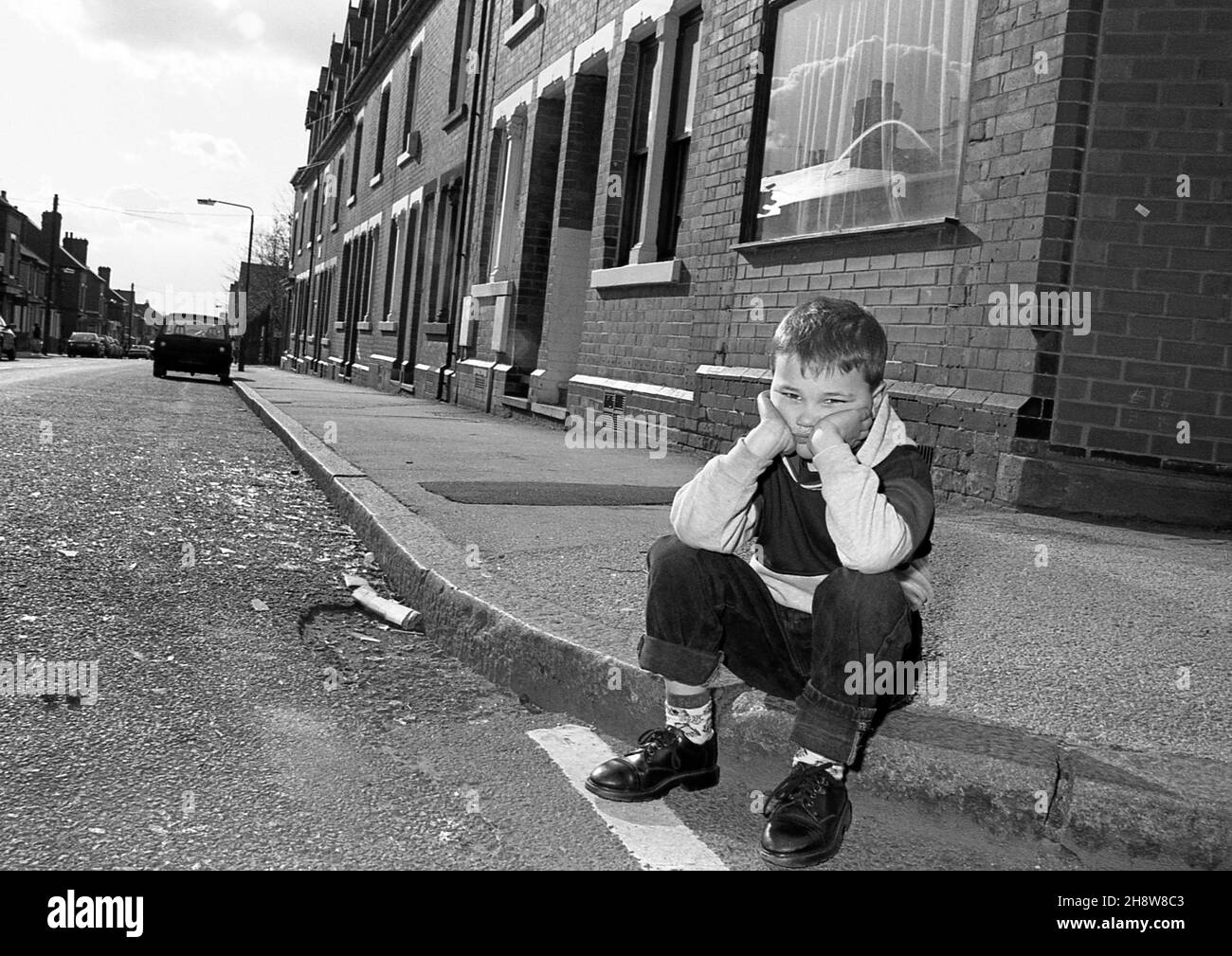 Boy in front of rundown terraced housing, Nottingham UK 1990s MR Stock ...