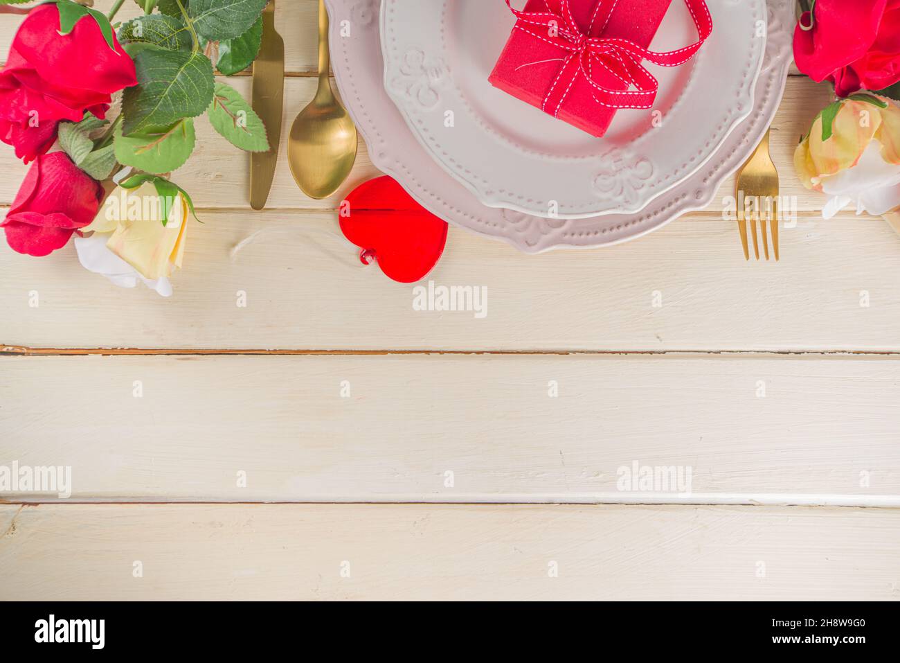 Valentine table setting. Table Dinner place with plates, silverware ...