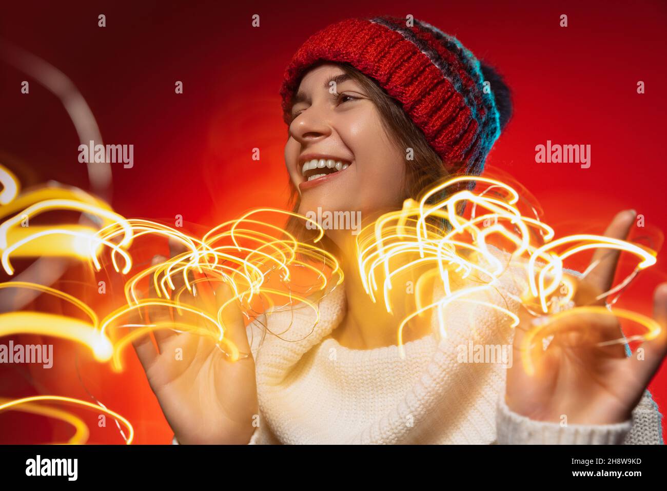 Cropped Portrait Of Young Joyful Woman Holiday Sparkles Isolated Over