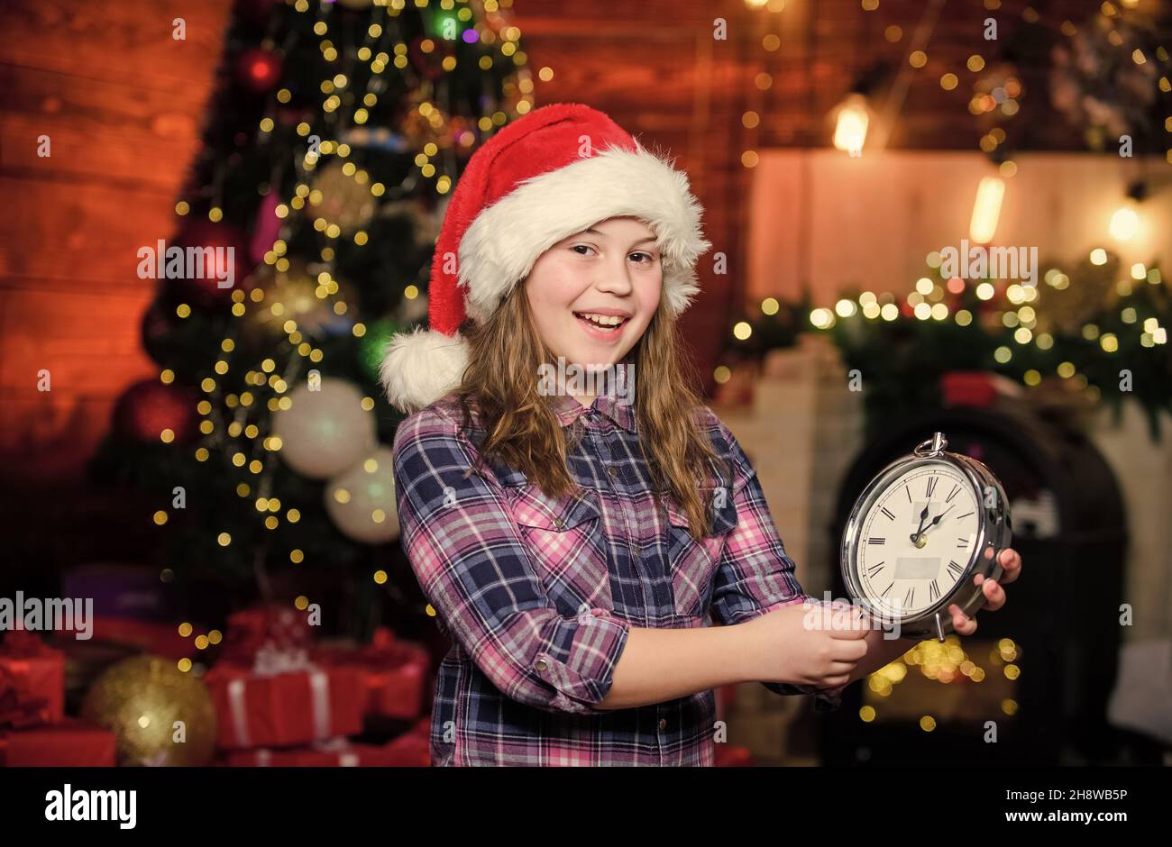 Im waiting. Santa claus little girl. Little girl in red hat. Wait for ...