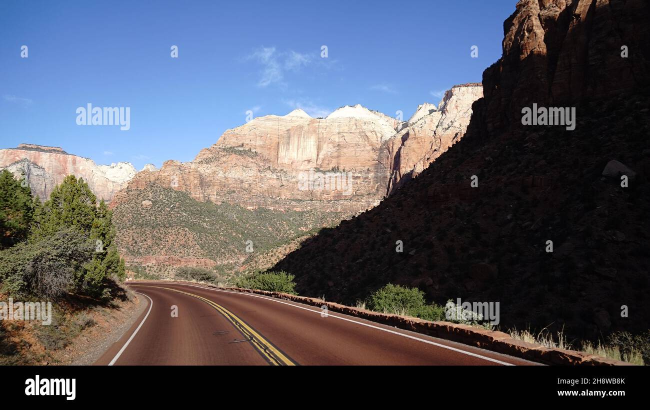 Highway through the steep red cliffs in the Zion National Park Stock ...