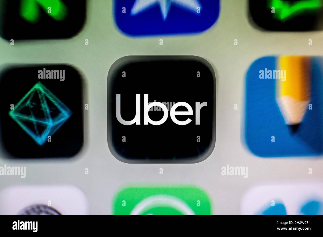 In this photo illustration a close-up of an Uber app icon seen ...