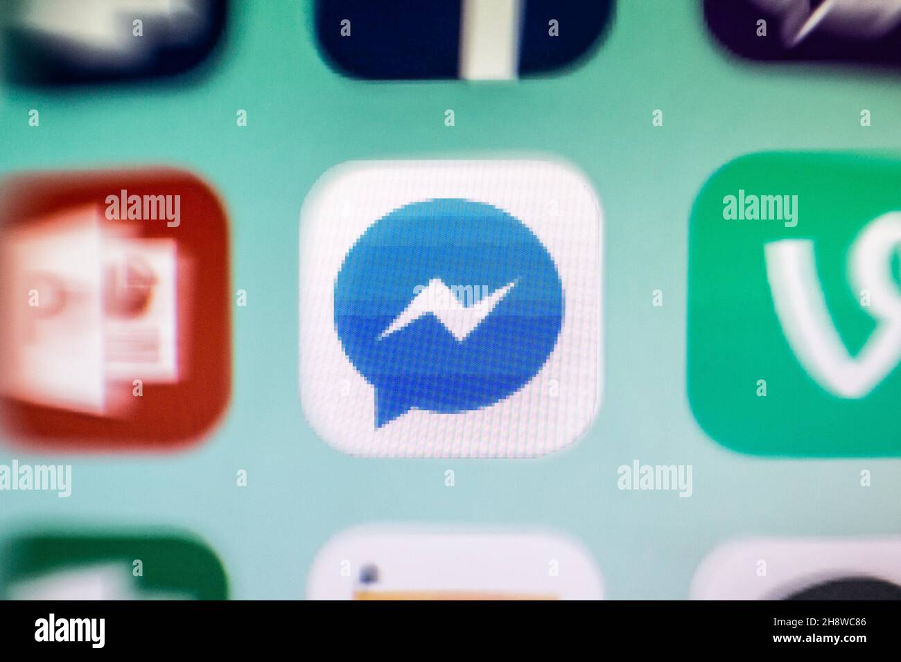 In this photo illustration a close-up of a Messenger app icon seen ...