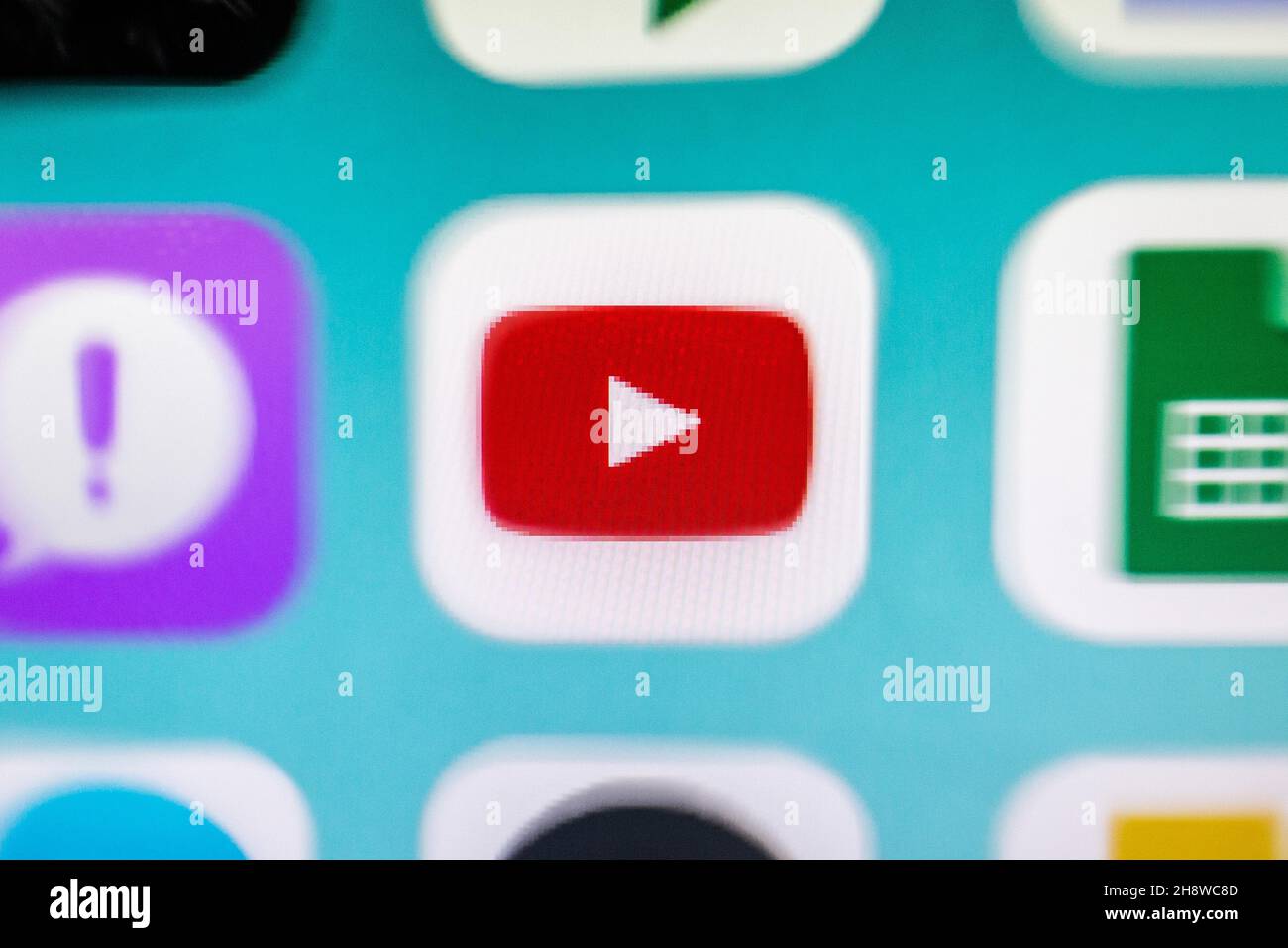 In this photo illustration a close-up of a YouTube app icon seen ...