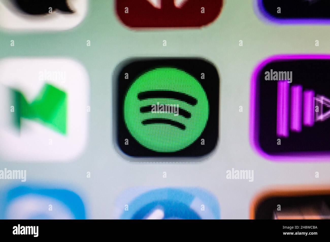 In this photo illustration a close-up of a Spotify app icon seen ...