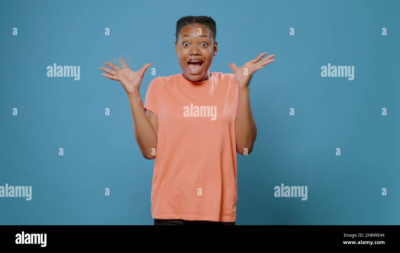 Excited woman with energy showing overjoyed expression, gesticulating ...