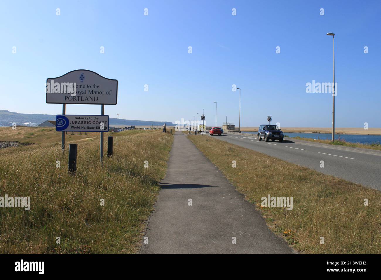 Welcome to the Isle of Portland sign. The England south west coast path ...
