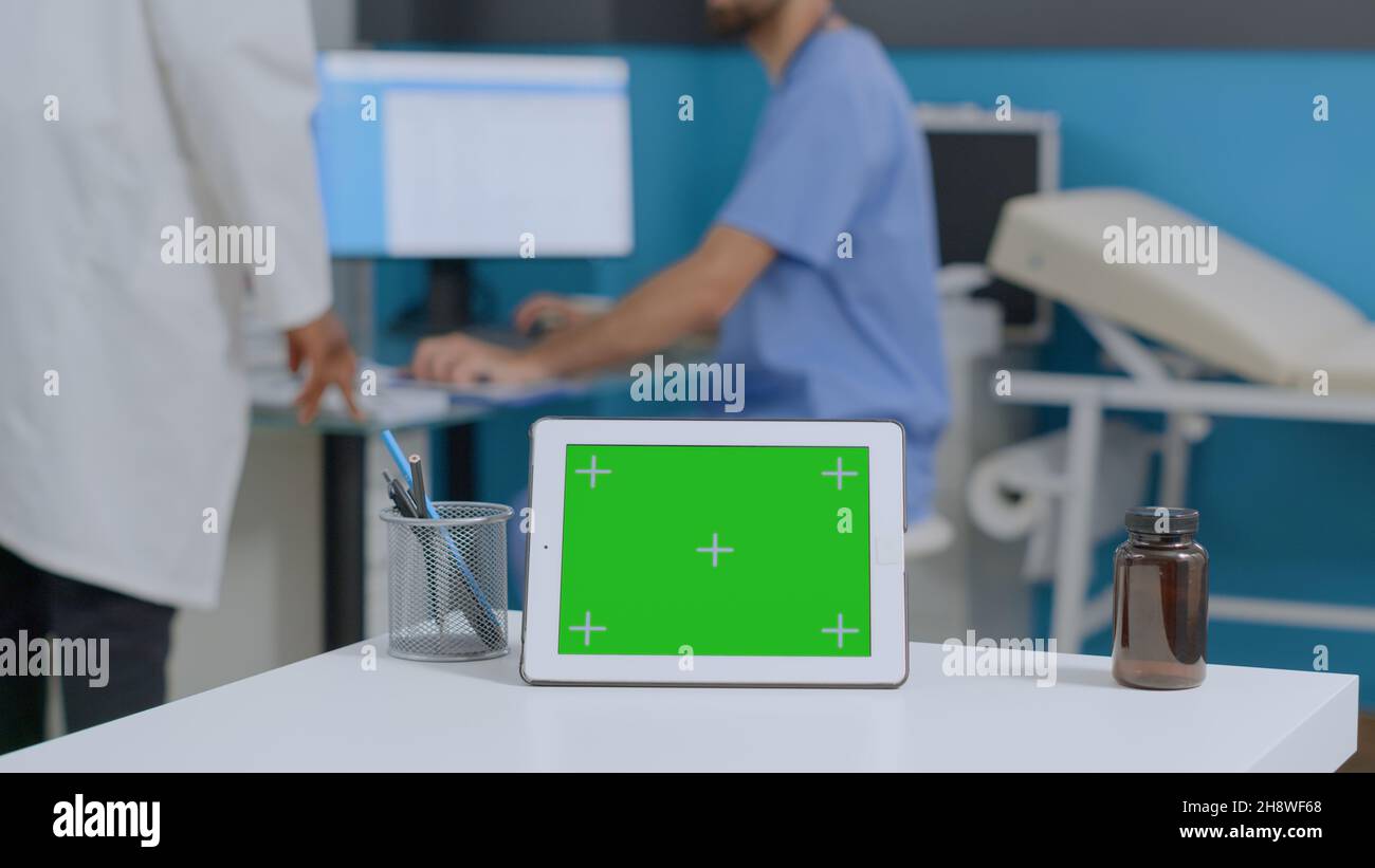 Closeup of mock up green screen chroma key tablet computer with ...