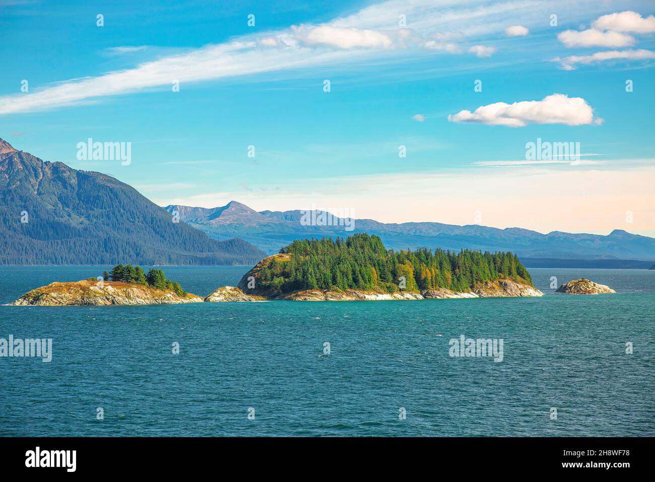 View of small island and mountains Stock Photo - Alamy