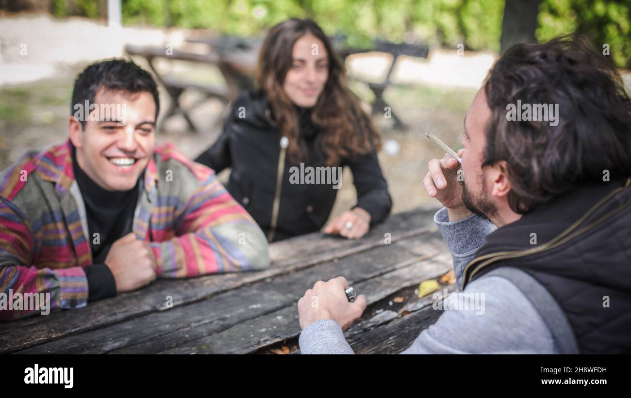 Group of relaxed and smiling happy young friends, female and male ...