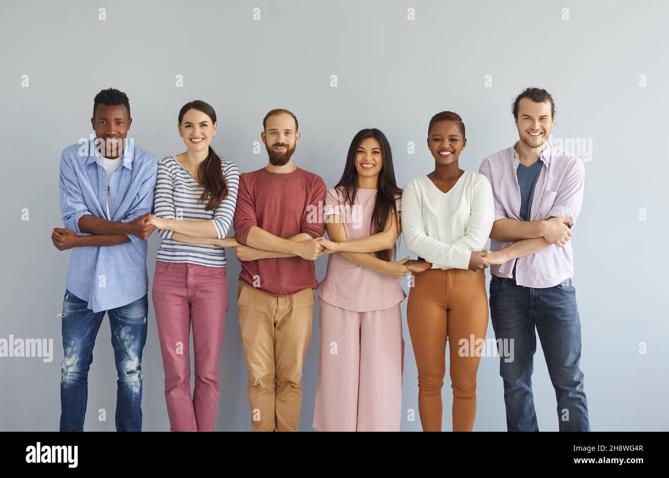 Group portrait of happy young diverse friends standing together ...