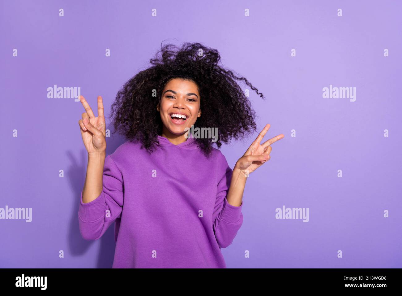 Photo of satisfied candid lady two hands make v-sign hello greetings ...