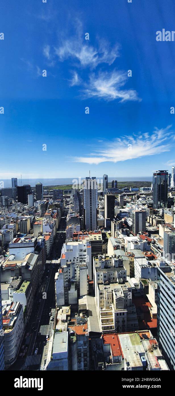 Vertical shot of buildings in downtown under the blue sky, Buenos Aires ...