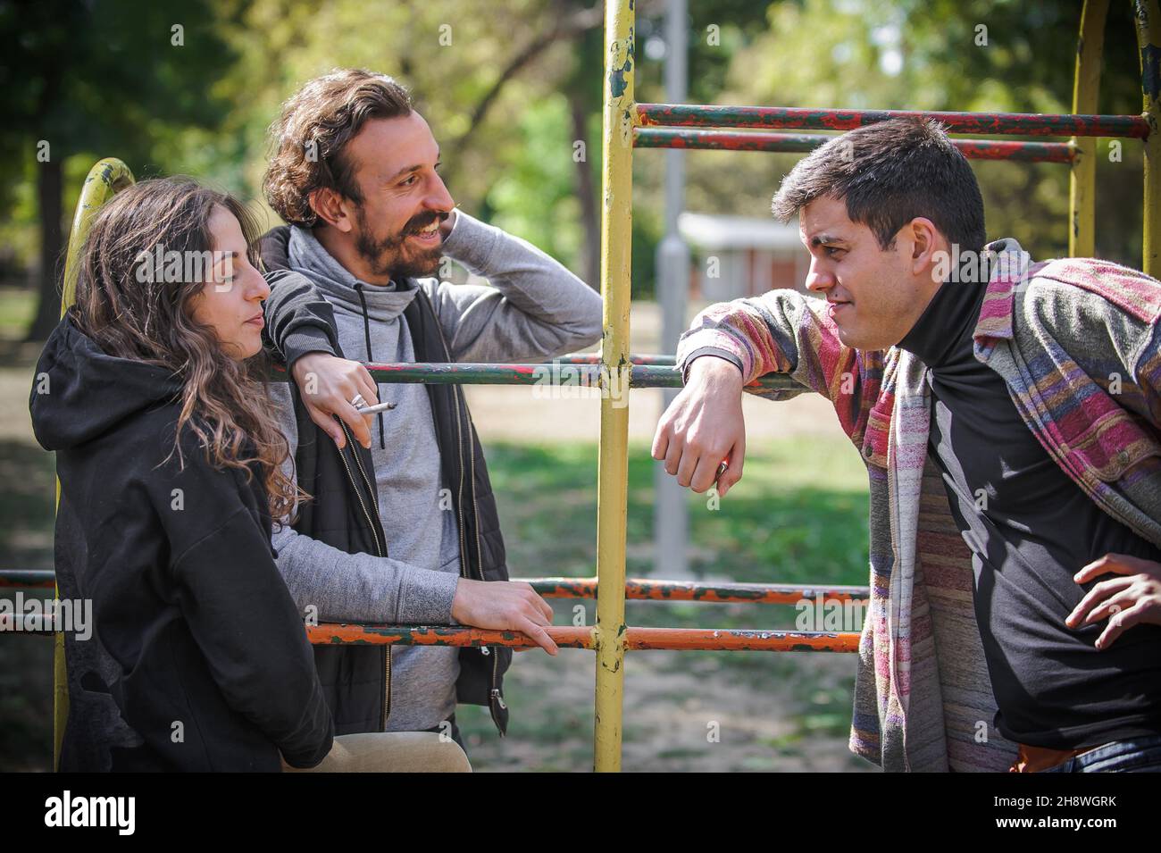 Group of relaxed and smiling happy young friends, female and male ...