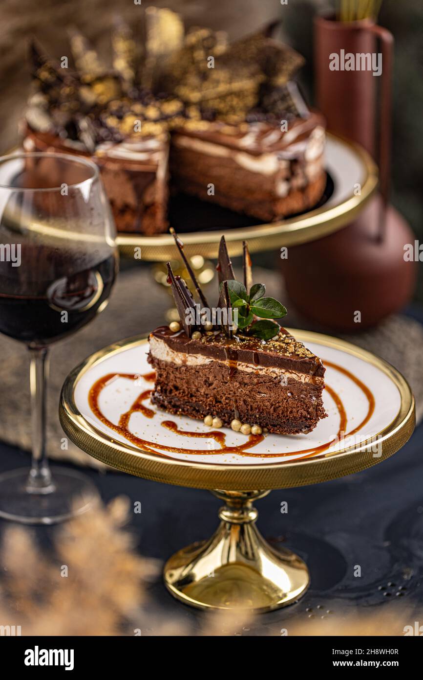 Cake stand with slice of tasty chocolate cake Stock Photo - Alamy