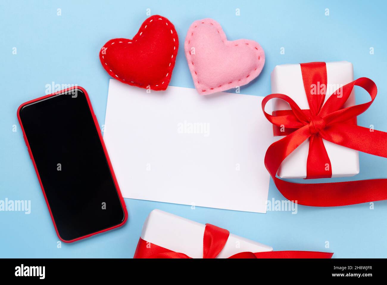 Valentines day greeting card template. Gift boxes, smartphone and heart ...