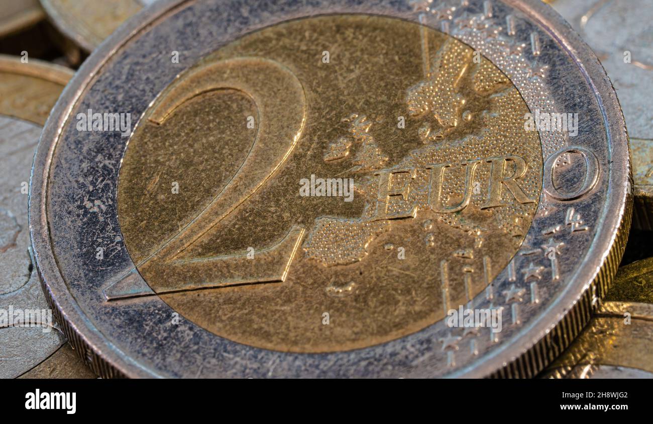 Two euro coin with small change Stock Photo - Alamy