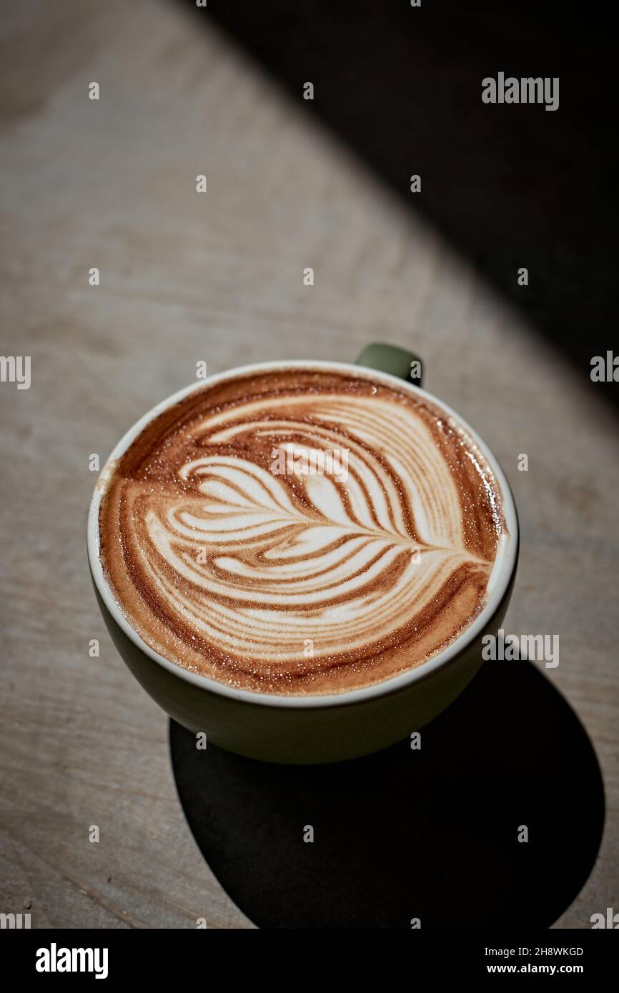 Selective focus cup of hot latte art coffee,focus at white foam Stock ...