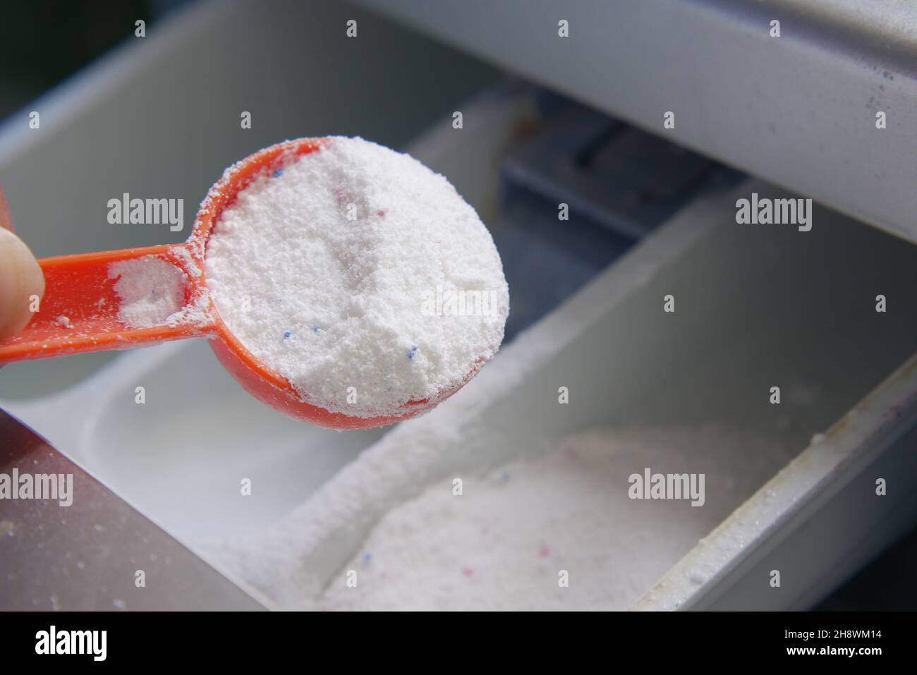 pouring Washing powder in plastic tray of washing machine Stock Photo ...