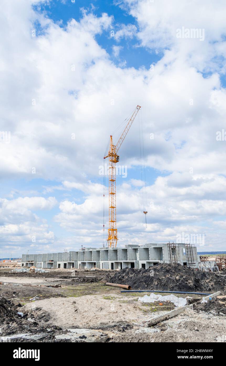Powerful crane and skyscrapers construction Stock Photo - Alamy
