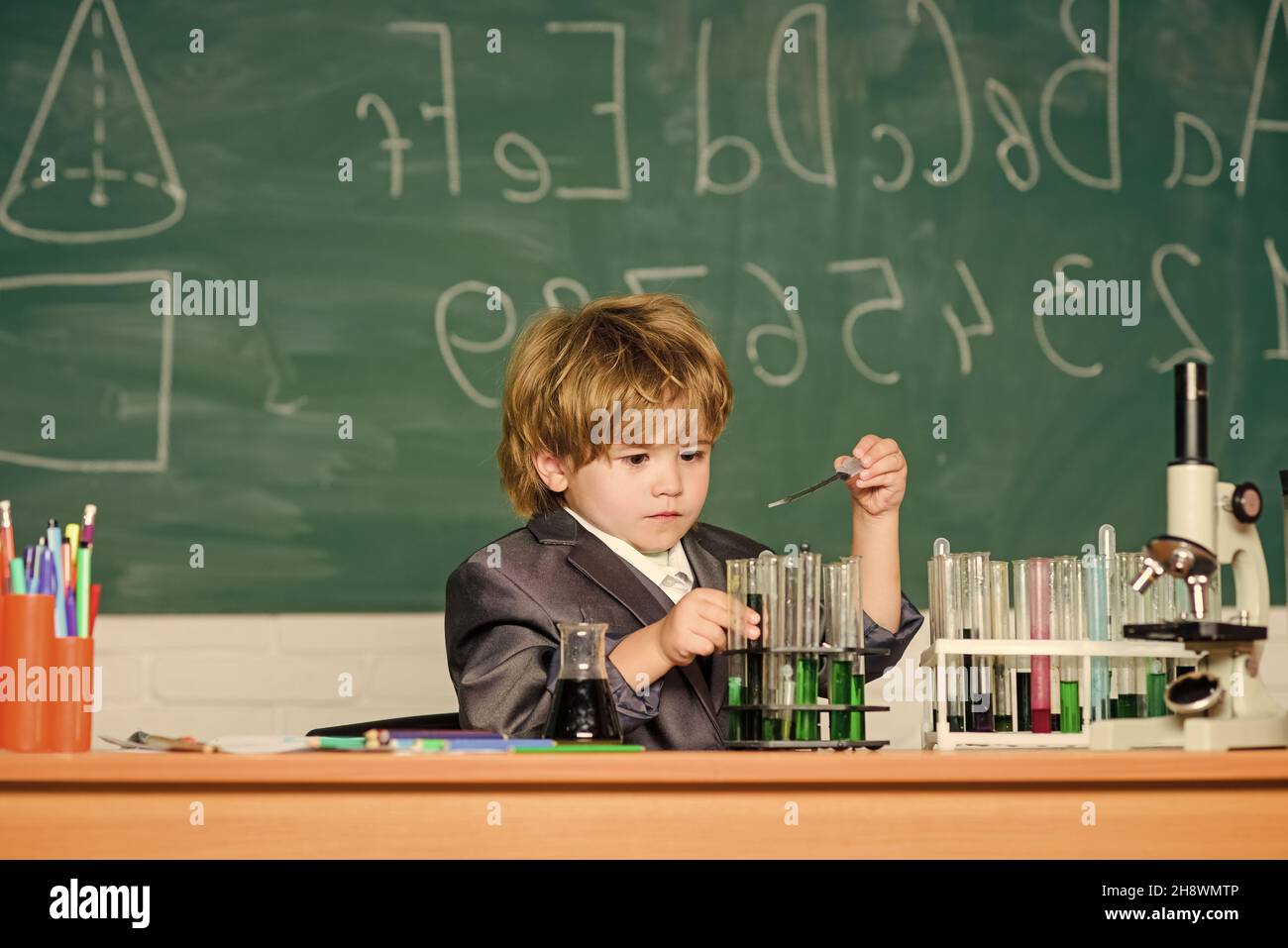 biology science. science experiments with microscope in lab. school kid ...