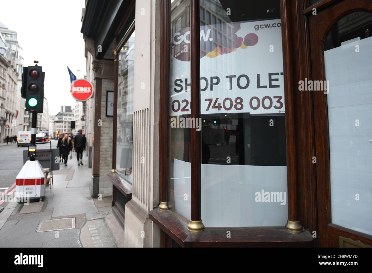 A shop to let sign is seen advertised in the window of an empty shop in ...