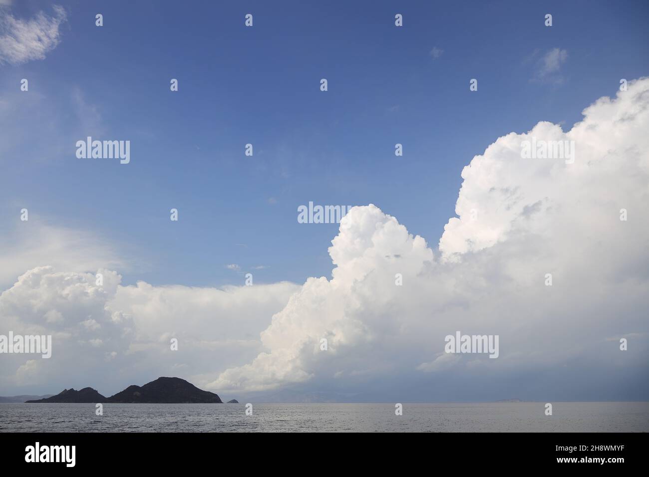Storm dramatic clouds over the surface of the sea Stock Photo - Alamy
