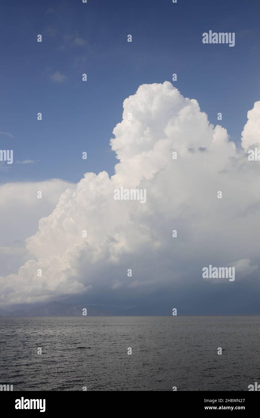 Storm dramatic clouds over the surface of the sea Stock Photo - Alamy