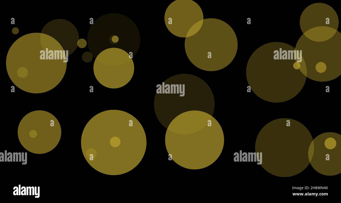 Full frame of golden spotted lens flare pattern on black background ...