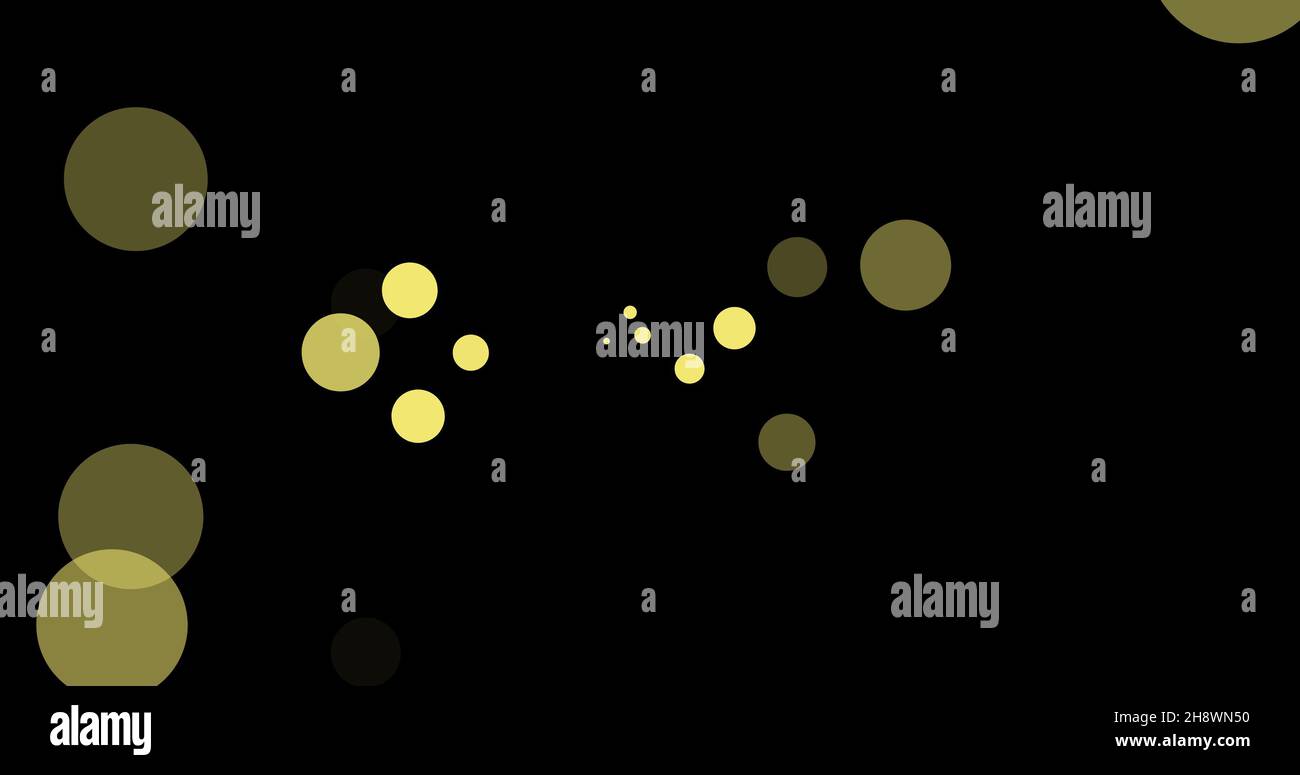 Digital composite image of golden lens flare pattern on black ...