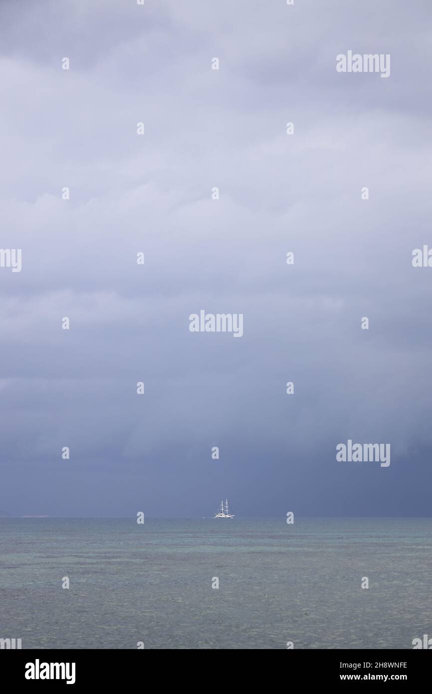 Boat sailing in the upcomming storm. Sailboat in bad weather sail at ...