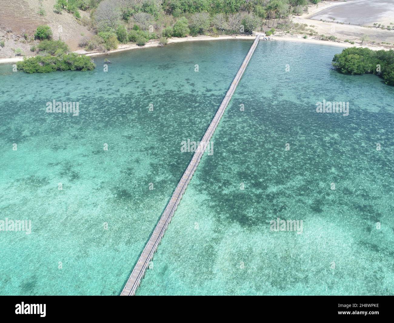A wooden bridge that connects from the bay to the Manjarite Island at ...