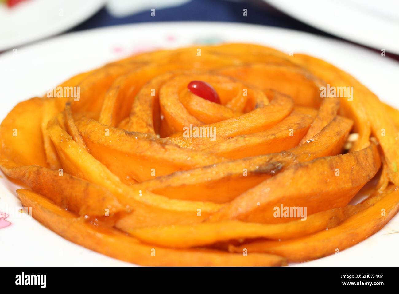 Sliced mango Decoration with Cherry on Plate Stock Photo - Alamy