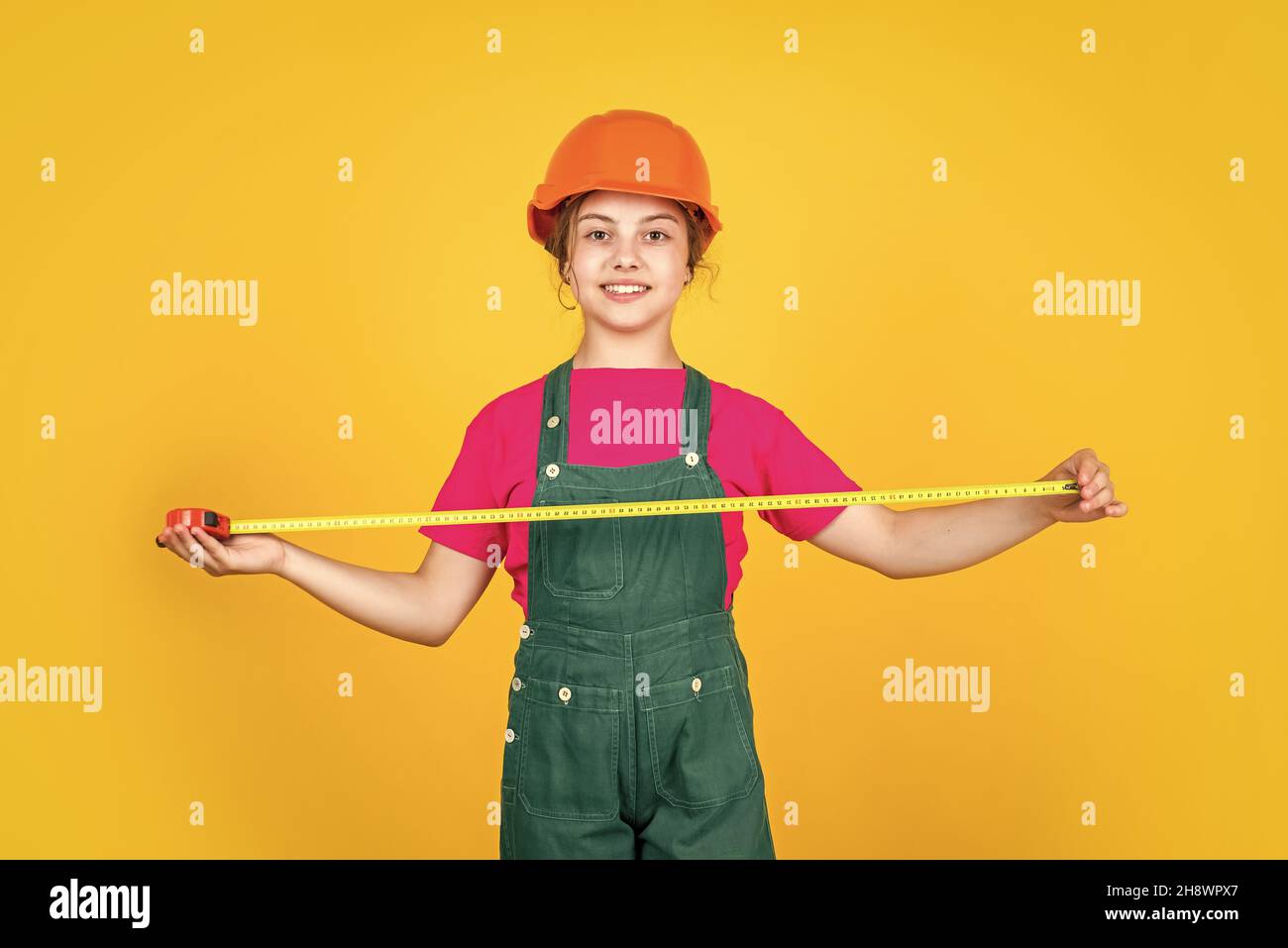 kid repairing home. happy childhood. self-retracting metal tape measure ...