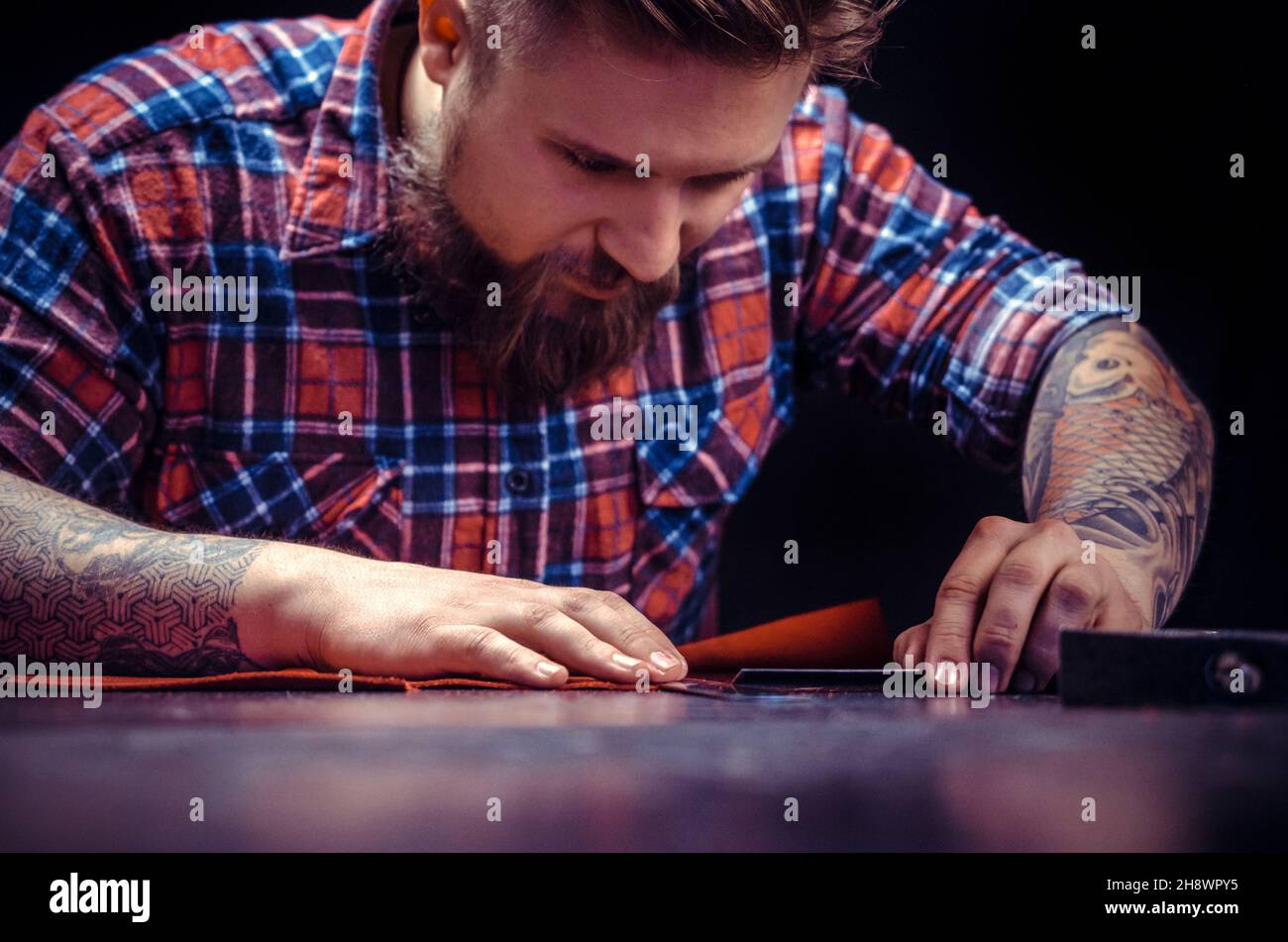 Leather Artist forming new leather production at the leather studio ...