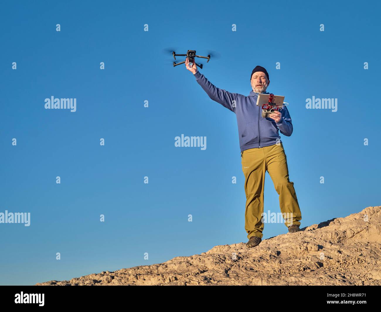 Grover, CO, USA - November 22, 2021: Senior male pilot with ipad tablet ...