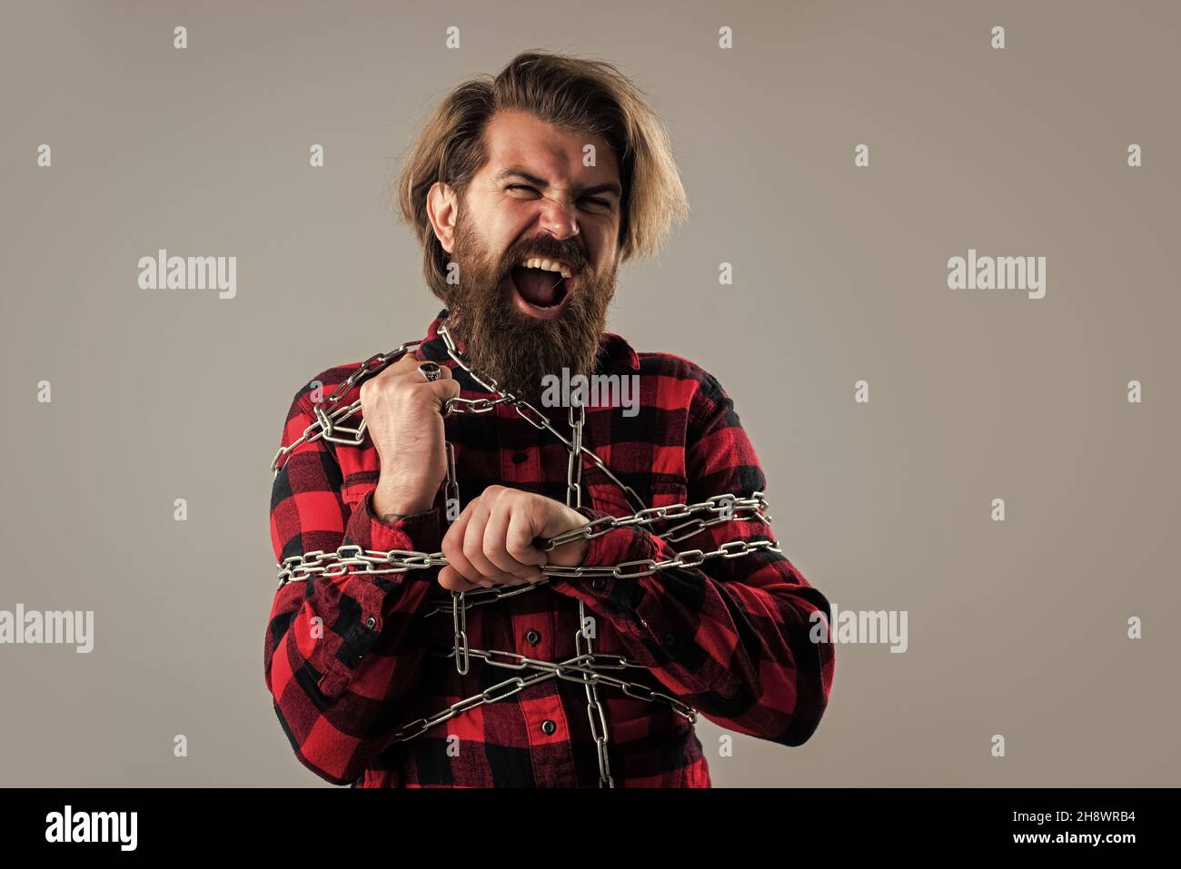 Chained bearded man hi-res stock photography and images - Alamy