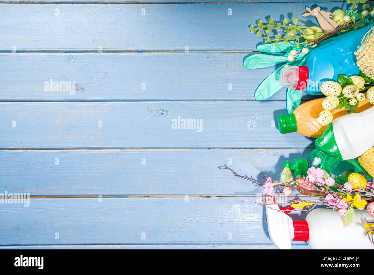 Spring cleaning concept. Sun lighted bright blue background with ...