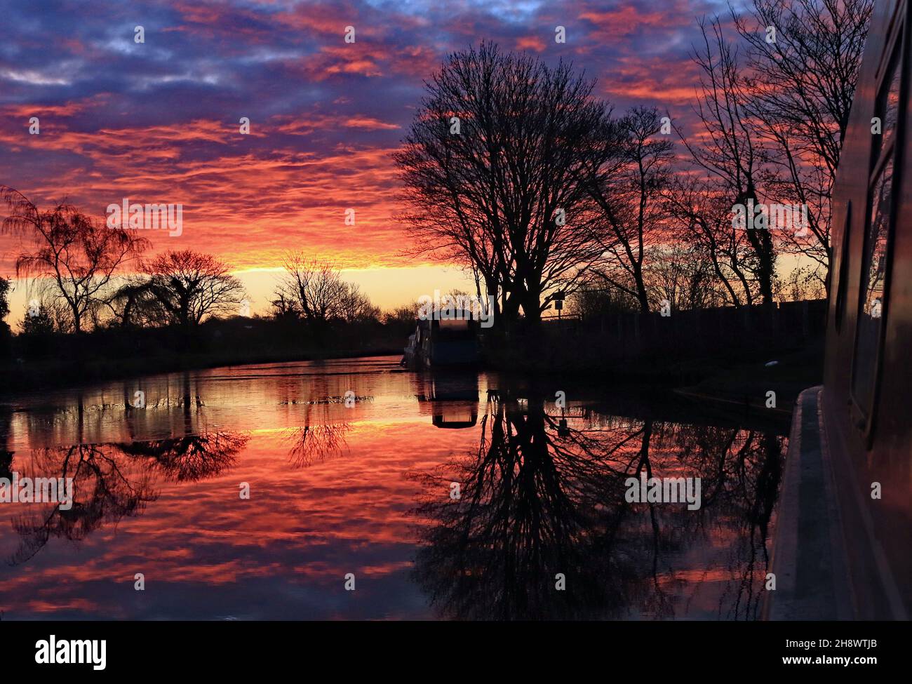 The red firey sun is just coming up over an icy and cold Leeds and ...